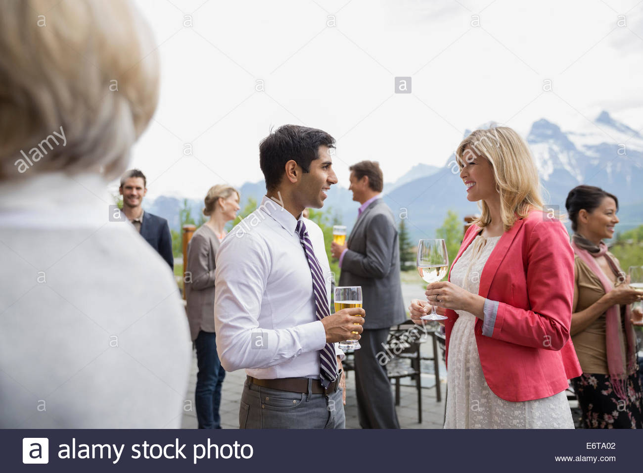 Business people talking at networking event Stock Photo - Alamy