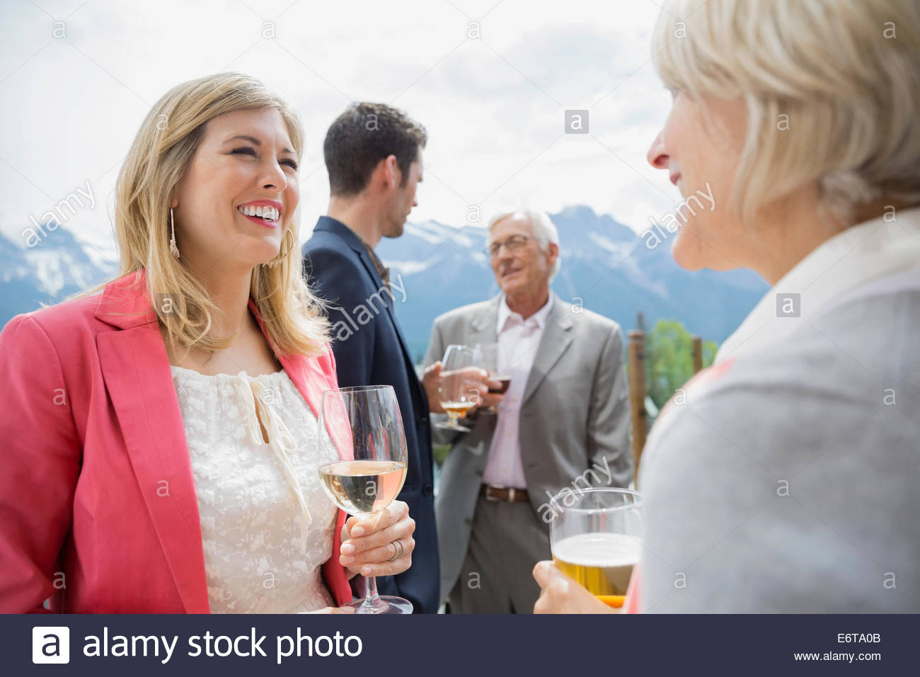 Four young people talking hi-res stock photography and images - Alamy