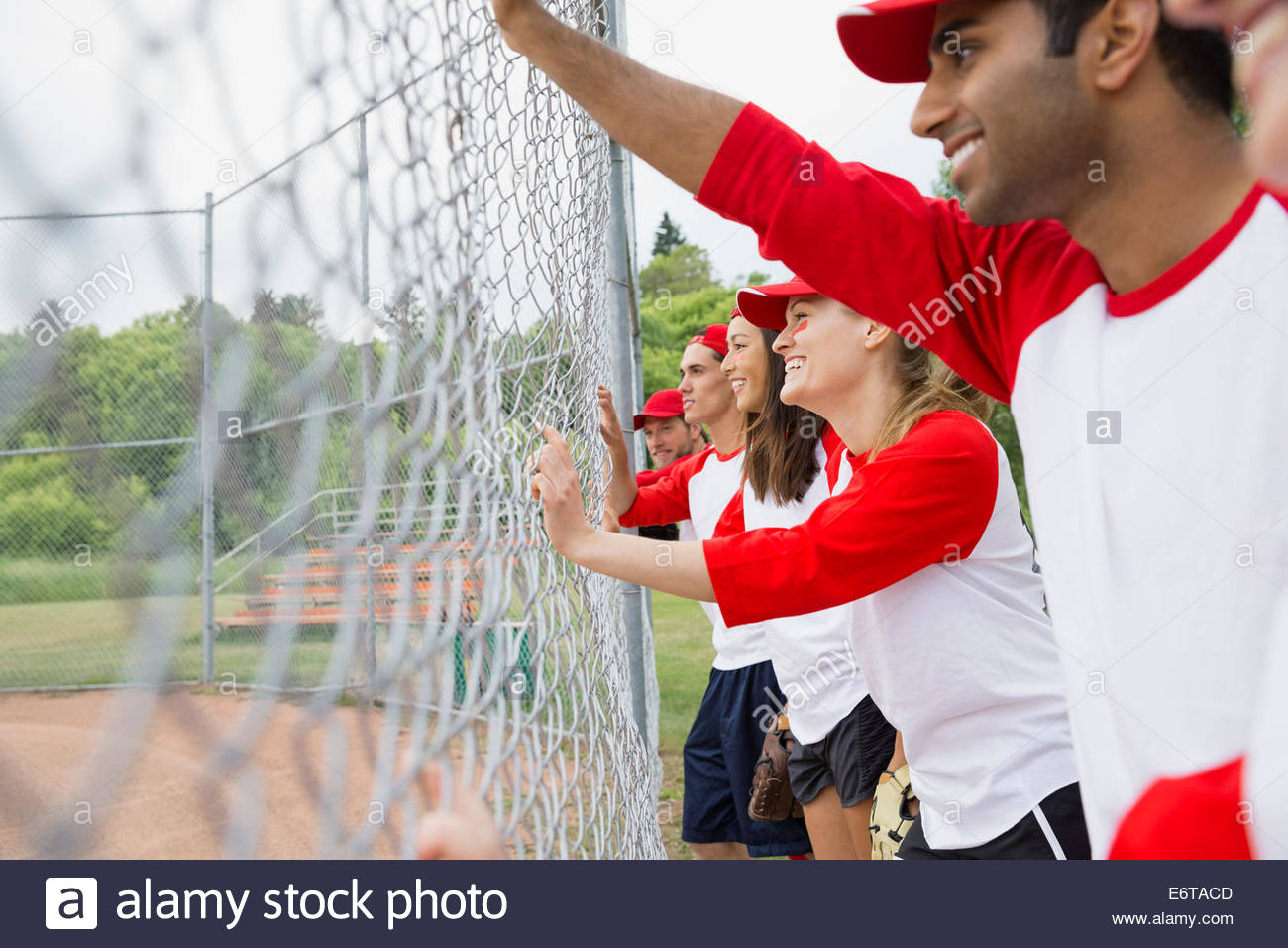 Group of people standing behind fence hi-res stock photography and ...
