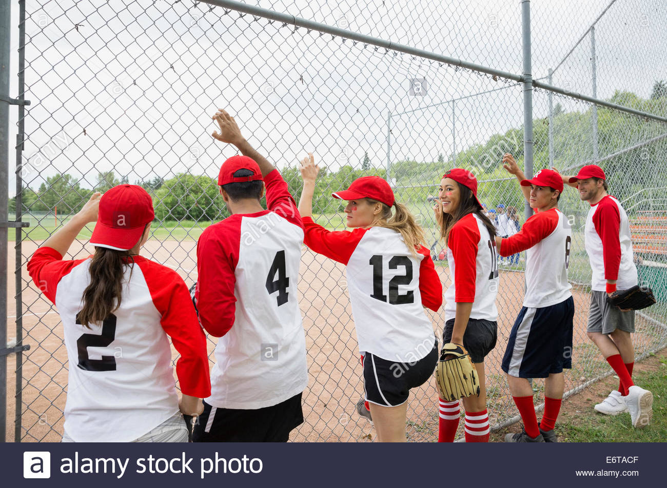 Group of people standing behind fence hi-res stock photography and ...
