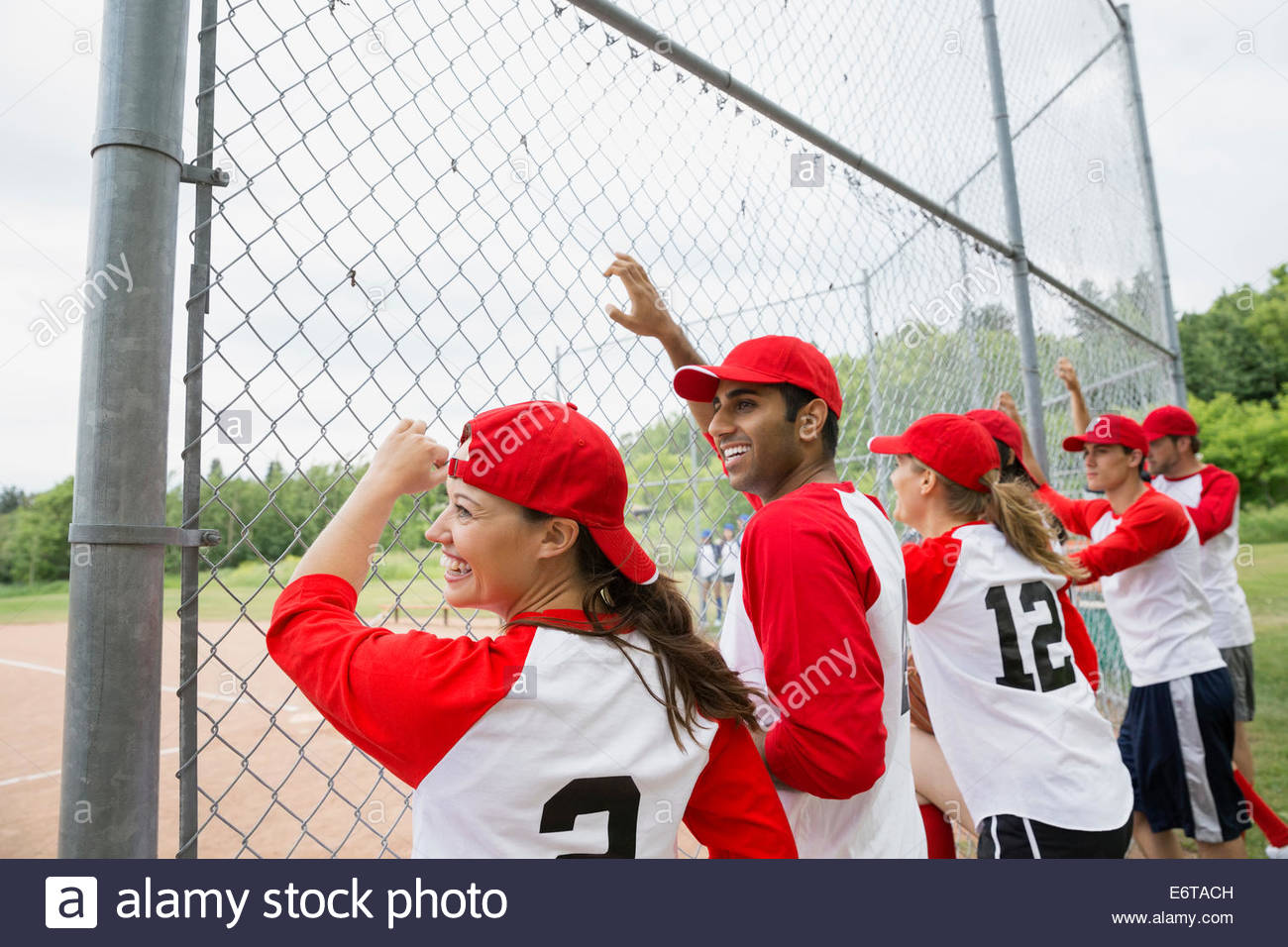 Group of people standing behind fence hi-res stock photography and ...