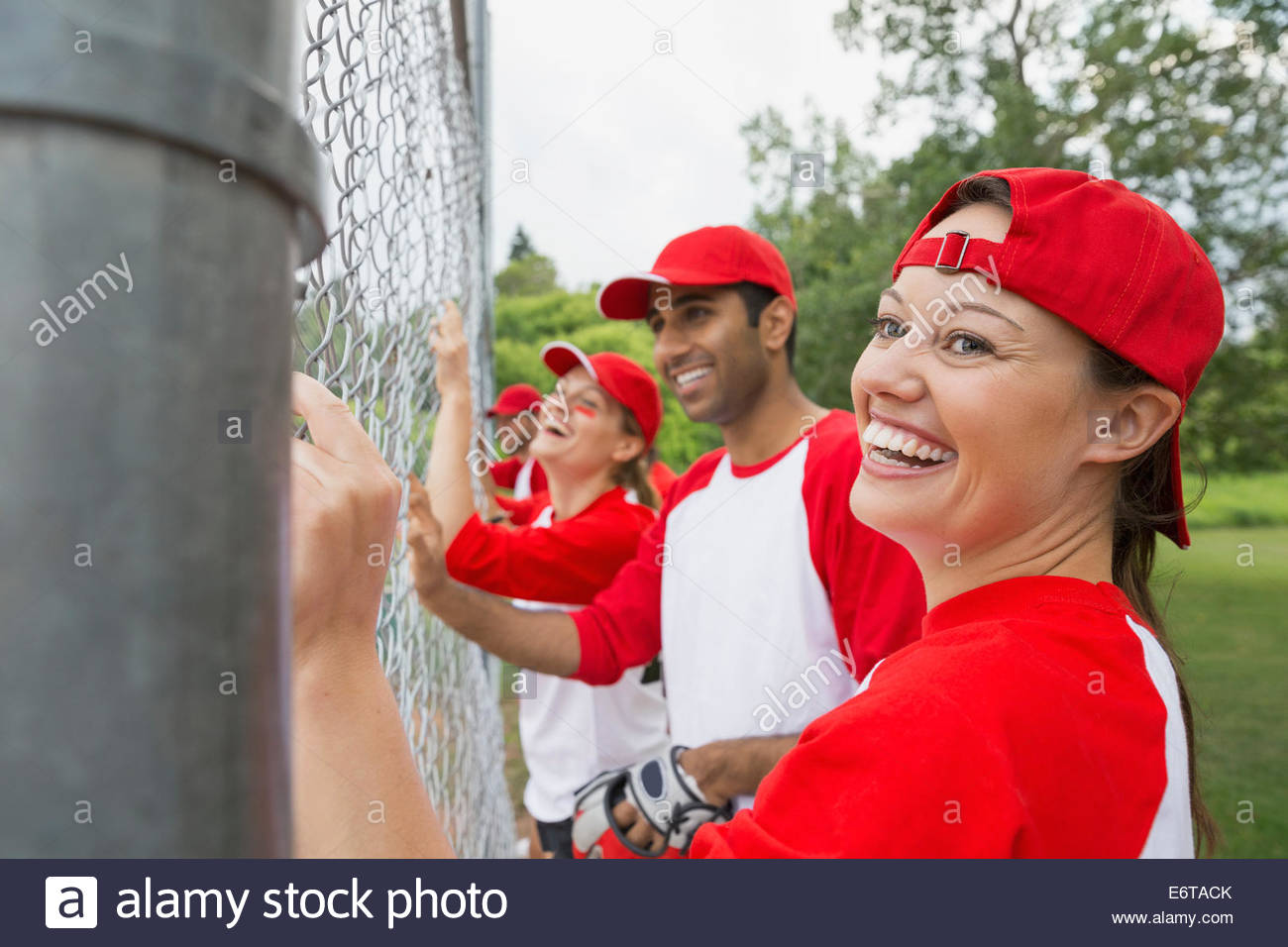 Group of people standing behind fence hi-res stock photography and ...