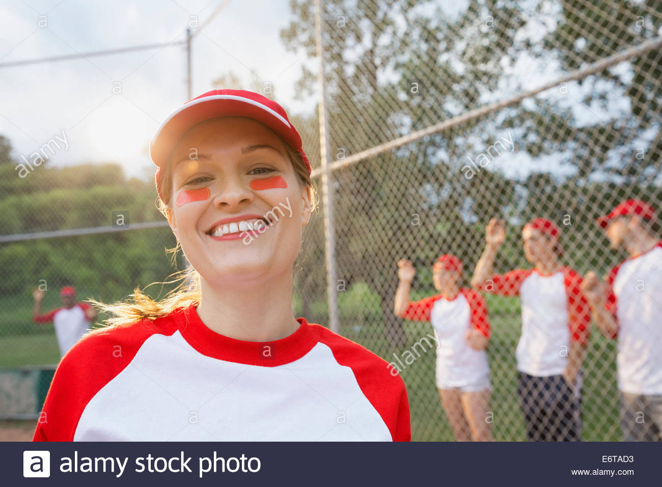 Baseball player smiling on field Stock Photo - Alamy