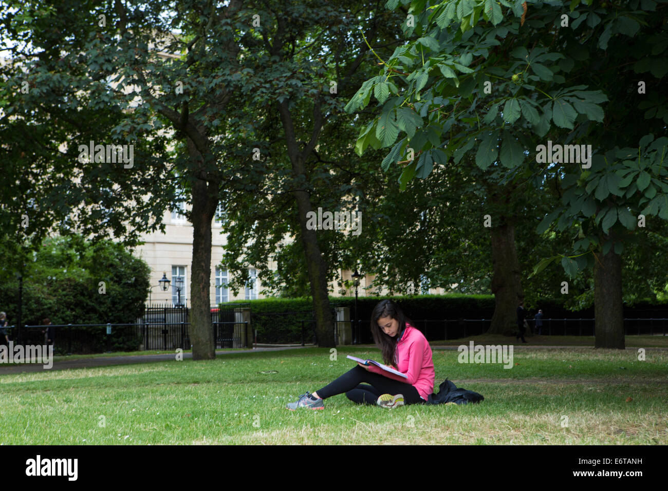 Young Woman Reading In A London Park High Resolution Stock Photography ...
