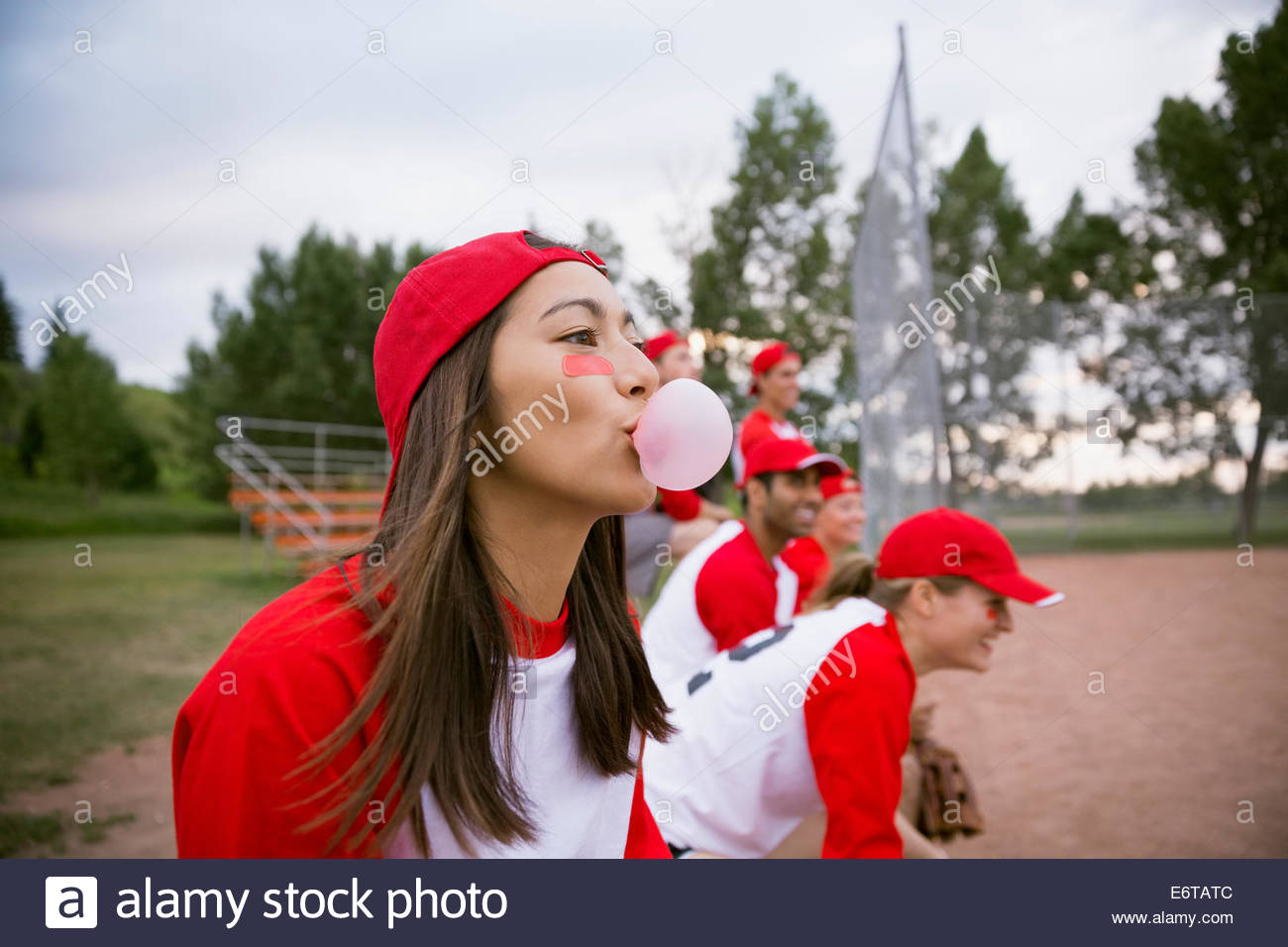 Baseball player blowing bubble gum bubble on field Stock Photo - Alamy