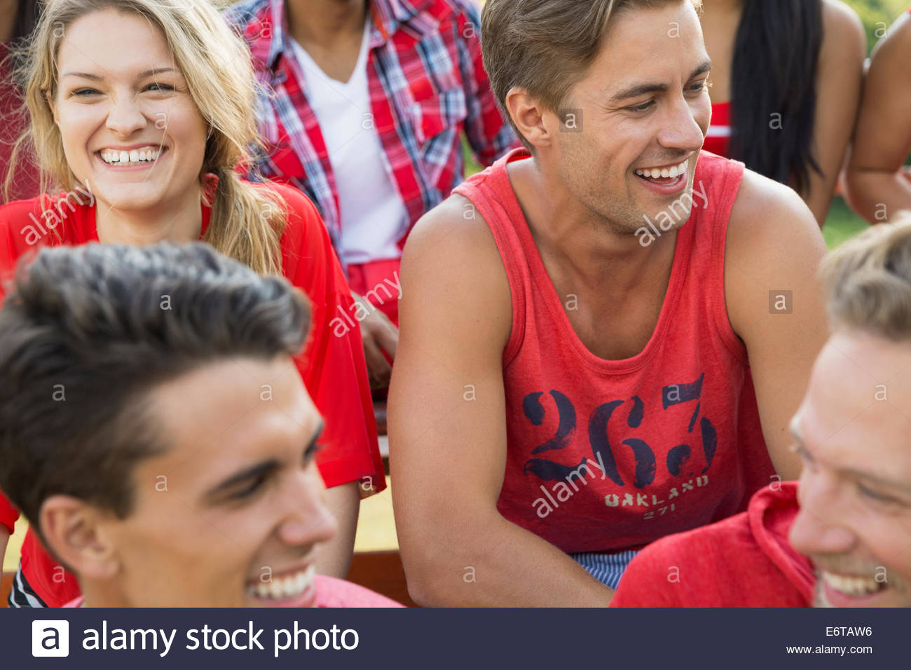 Couple laughing at sporting event Stock Photo - Alamy