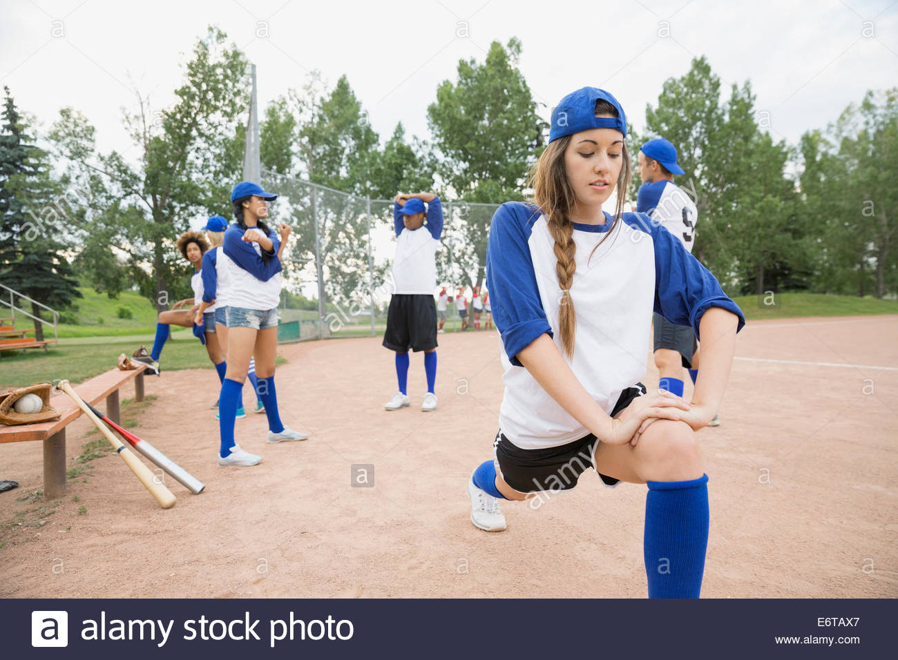 Baseball team stretching before game Stock Photo - Alamy