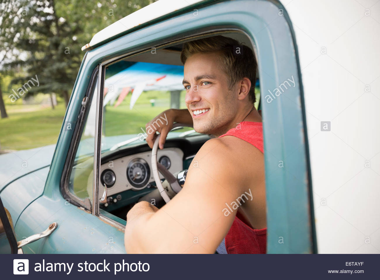 Man driving car looking back hi-res stock photography and images - Alamy