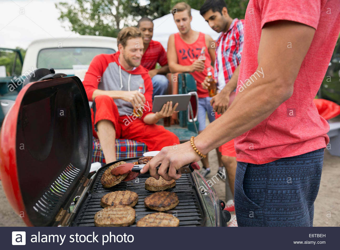 Man sitting on truck tailgate hi-res stock photography and images - Alamy