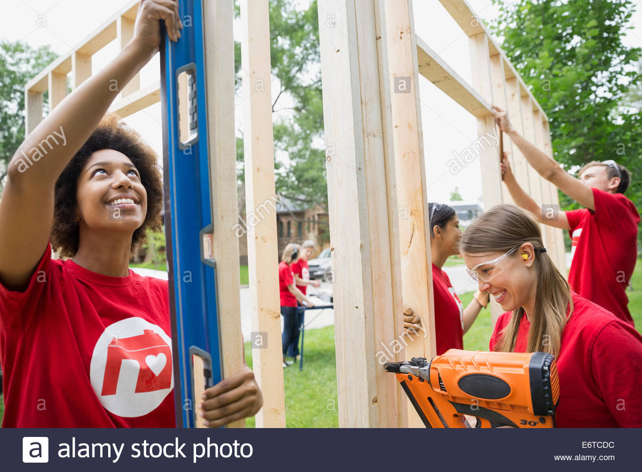 Volunteers assembling construction frame Stock Photo - Alamy