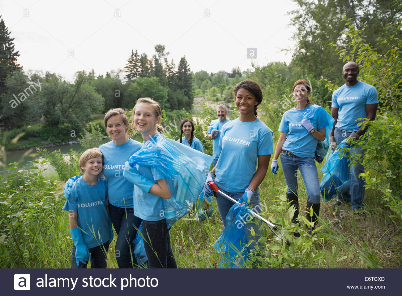 Man carrying garbage bags hi-res stock photography and images - Alamy