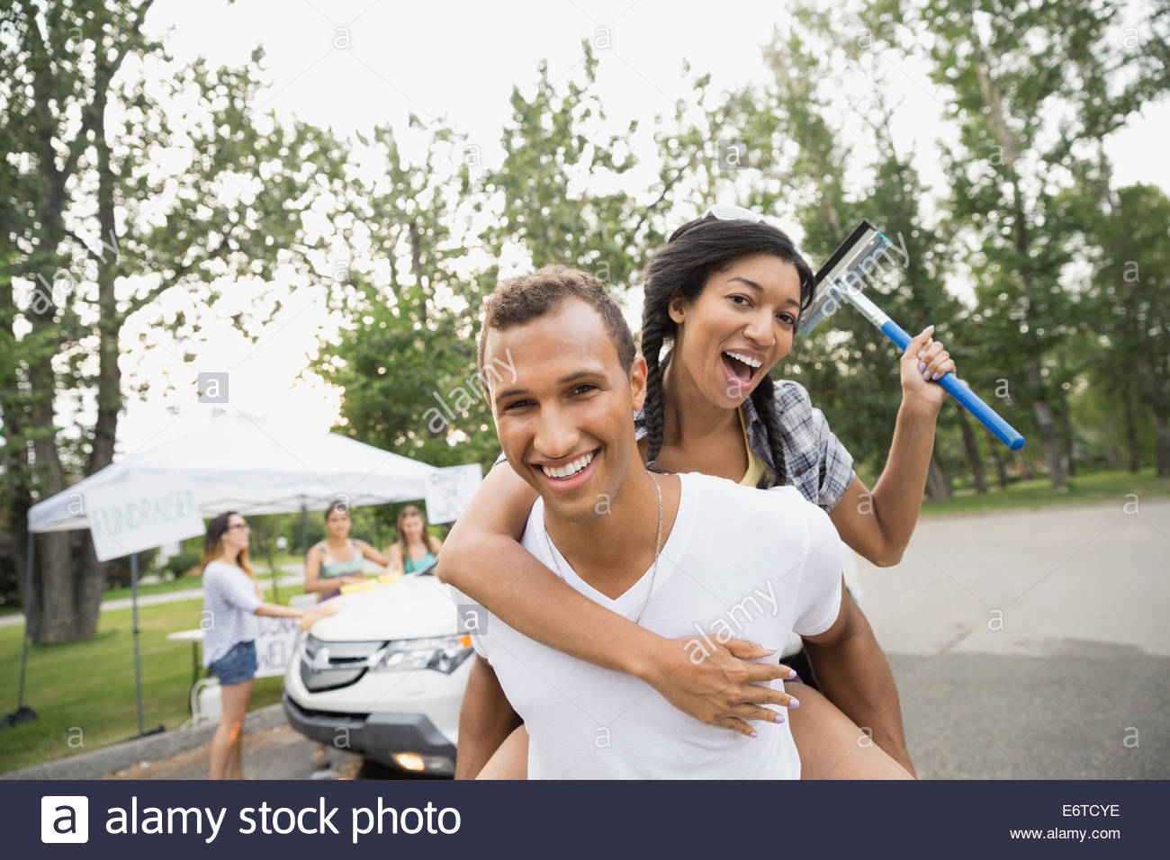 Group friends standing car on hi-res stock photography and images - Alamy