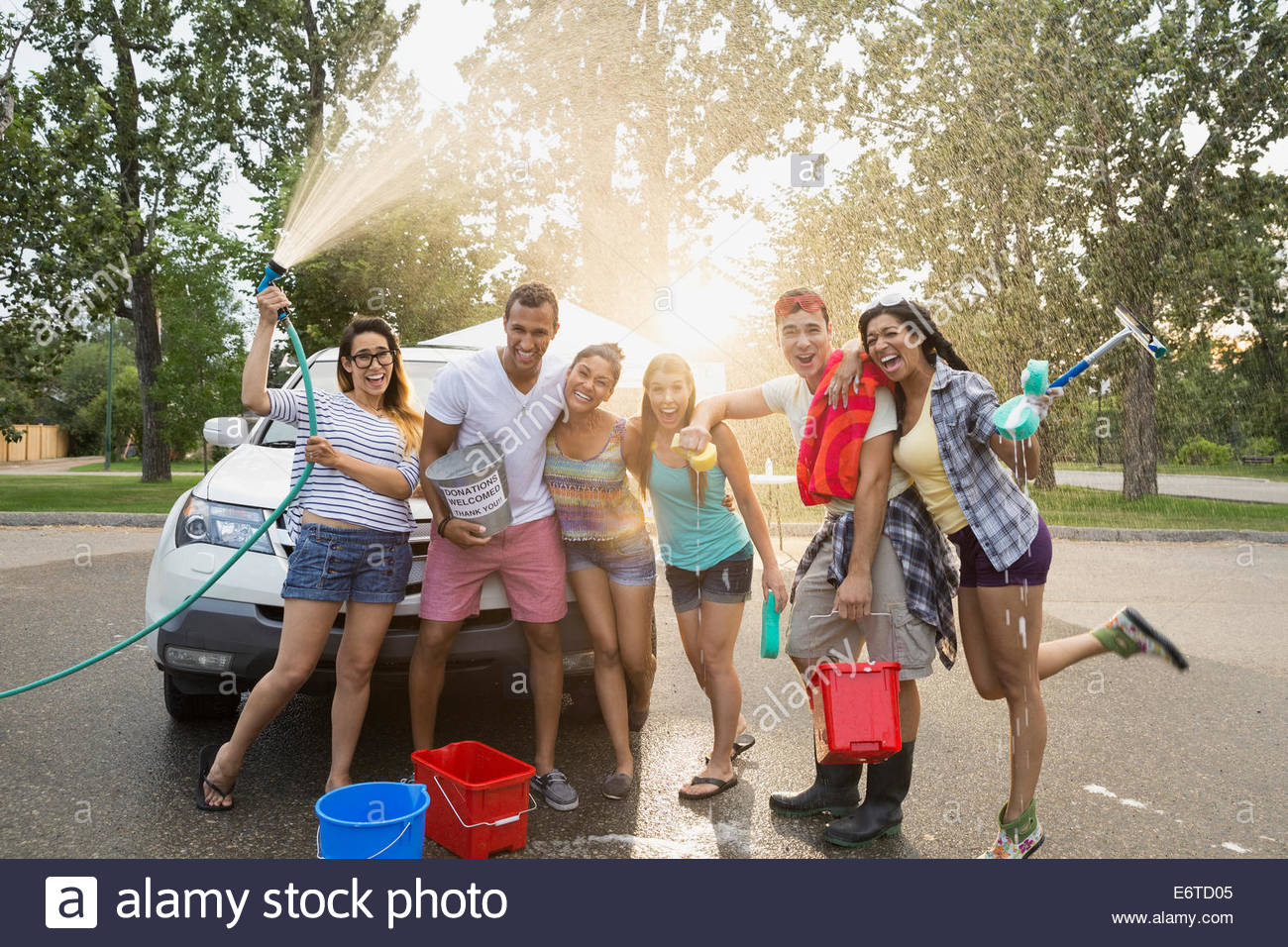 Happy man washing car hi-res stock photography and images - Alamy