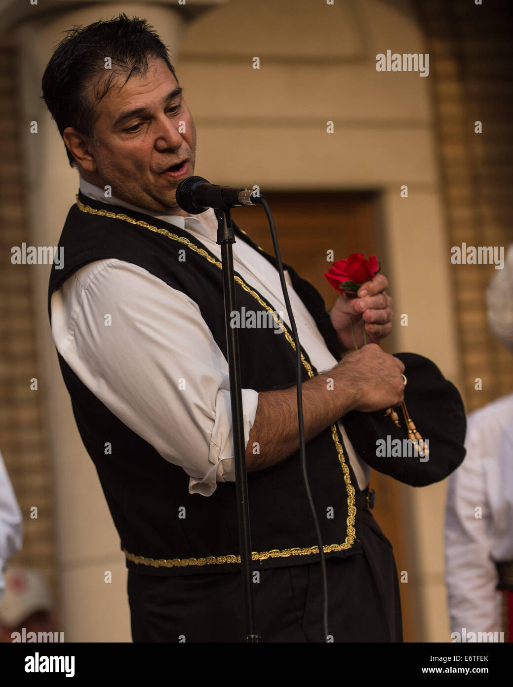 Ohio, US. 30th Aug, 2014. Tom Sfikas of the Hellenic Singers performs a ...
