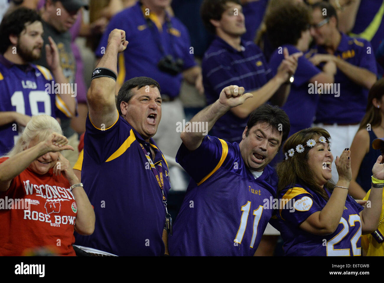 Houston, Texas, USA. 30th Aug, 2014. LSU fans celebrate the winning touchdown by LSU Tigers ...