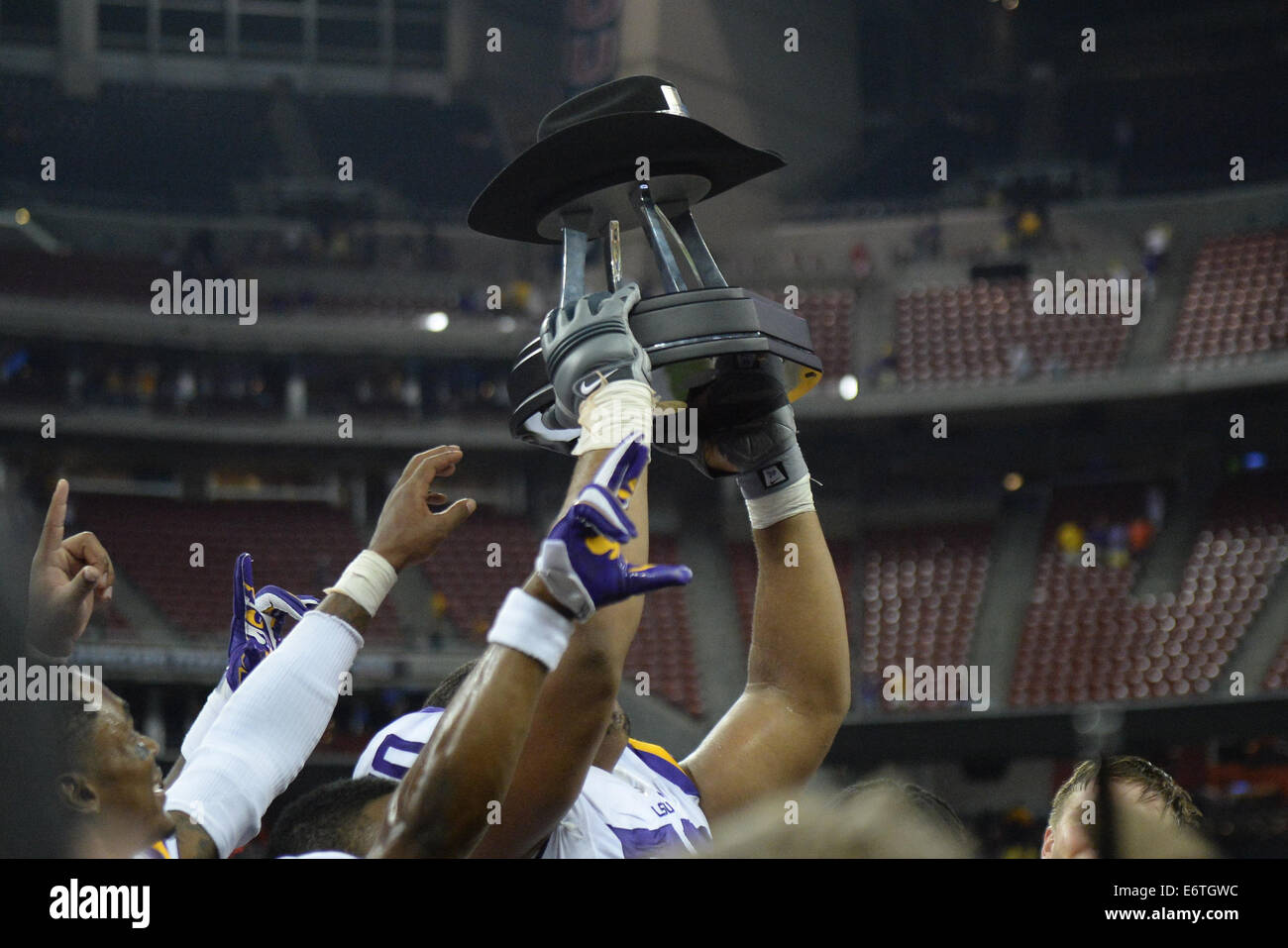 Houston, Texas, USA. 30th Aug, 2014. The LSU Tigers hold up the Texas ...