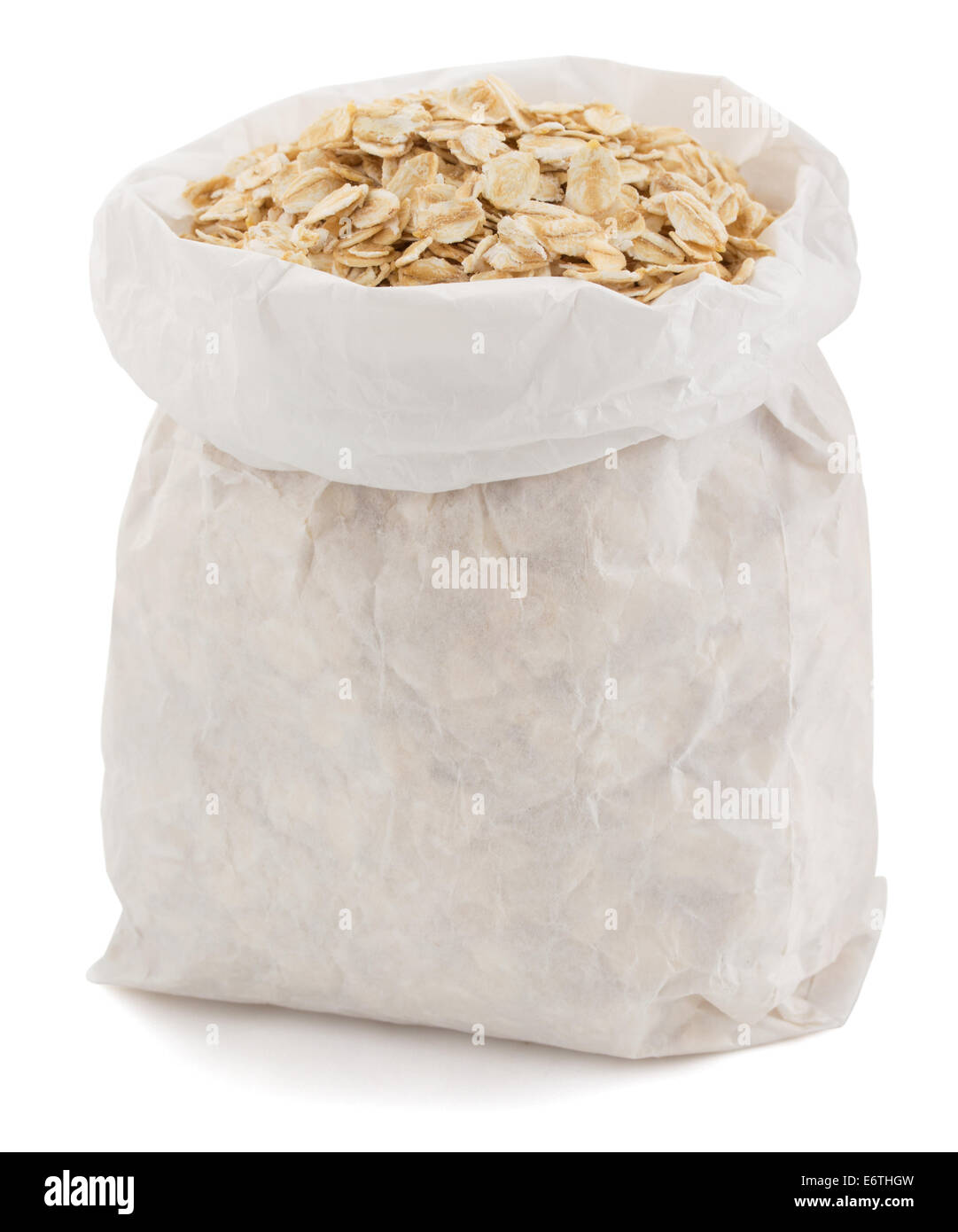 oat flakes in paper bag isolated on white background Stock Photo - Alamy