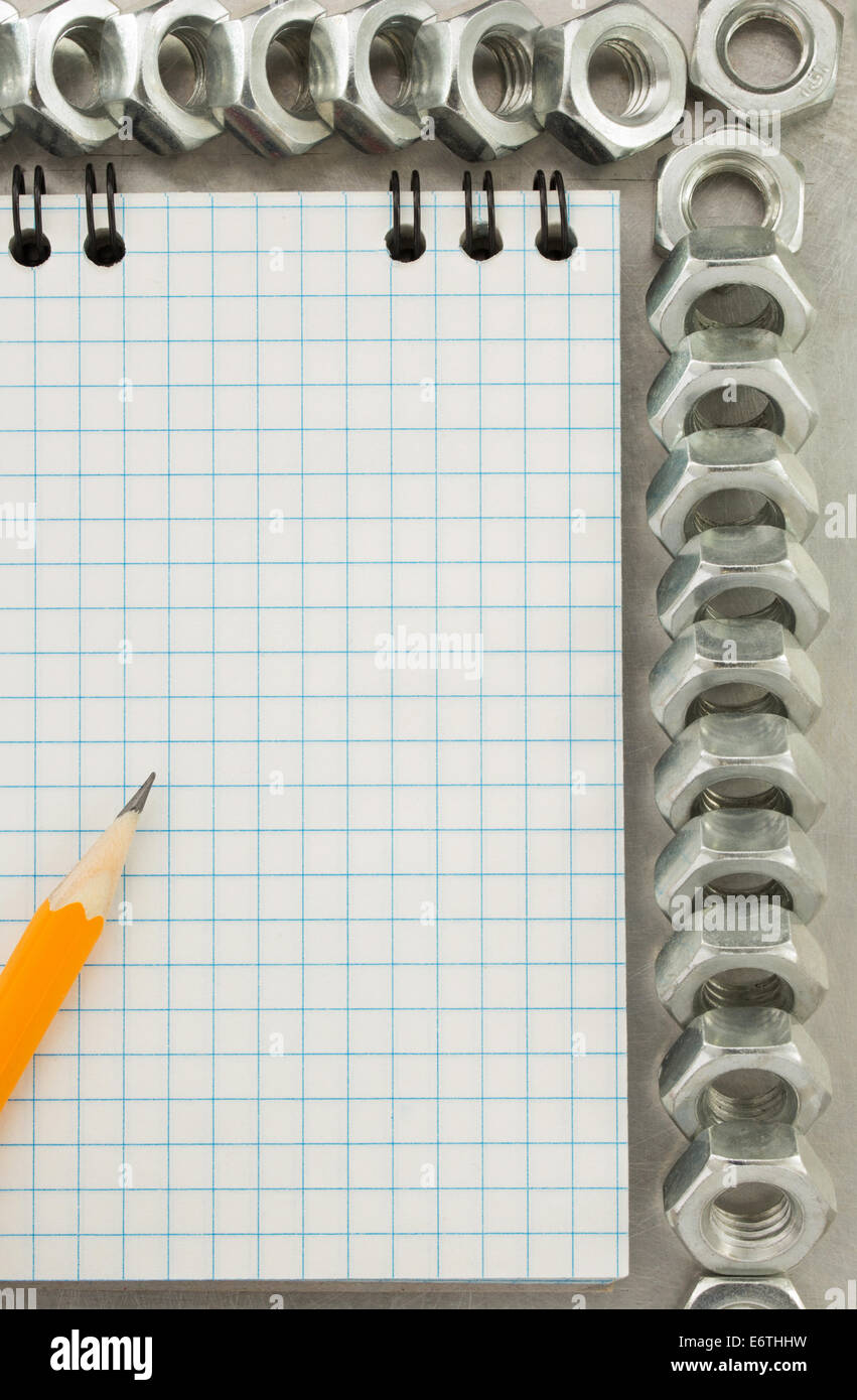 nuts tool and notebook at metal background Stock Photo - Alamy