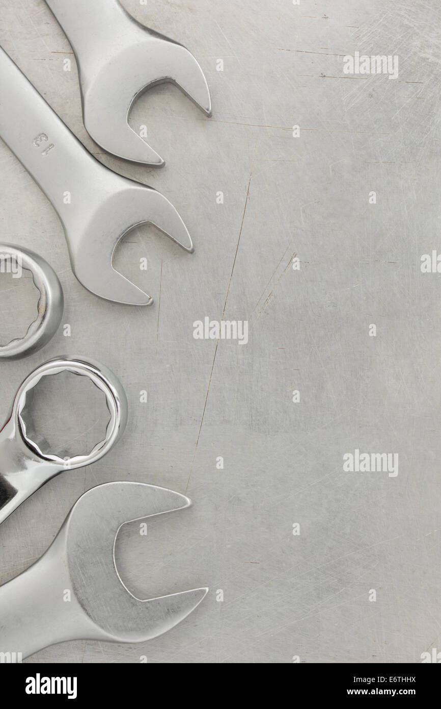 wrench tools at metal background Stock Photo - Alamy