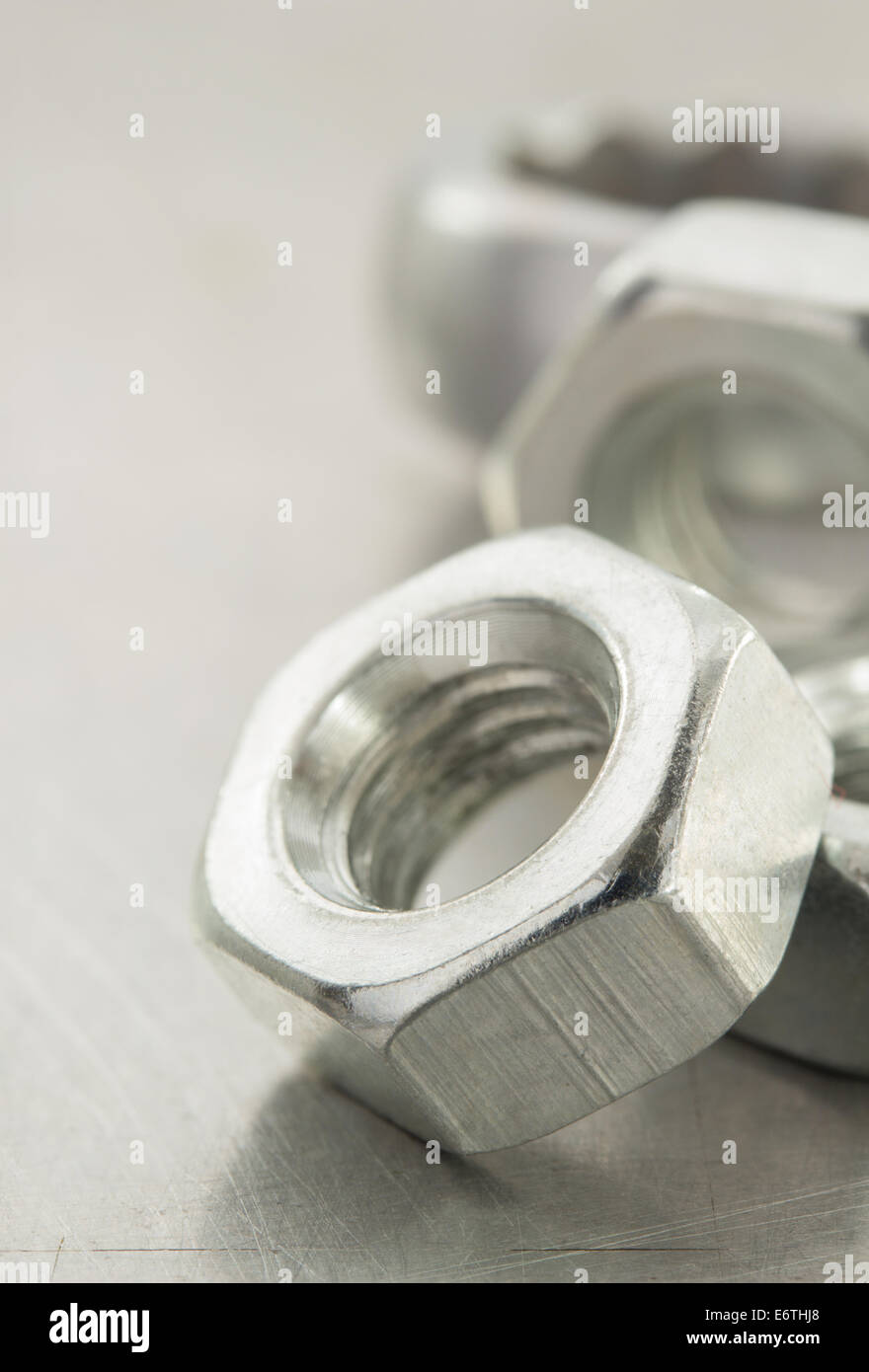 nuts tool at metal background texture Stock Photo - Alamy