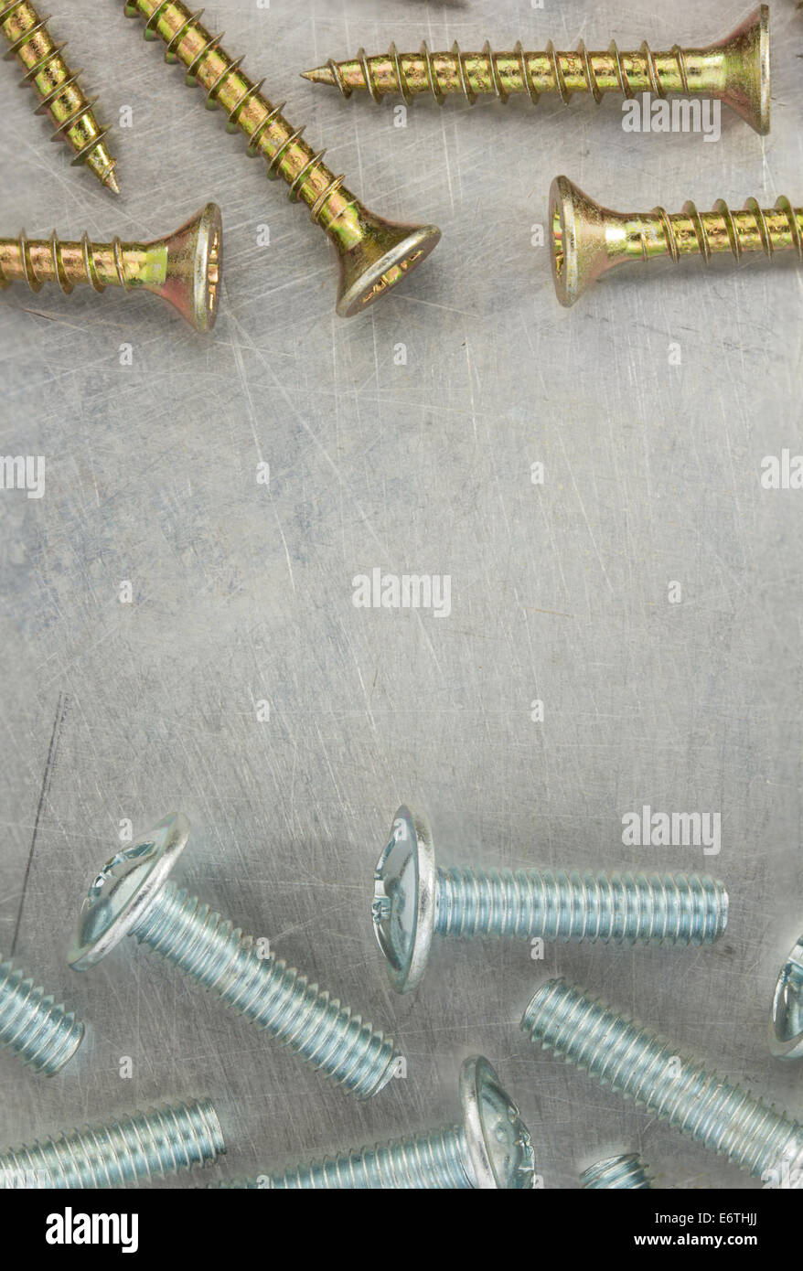 bolts and screws at metal background texture Stock Photo - Alamy