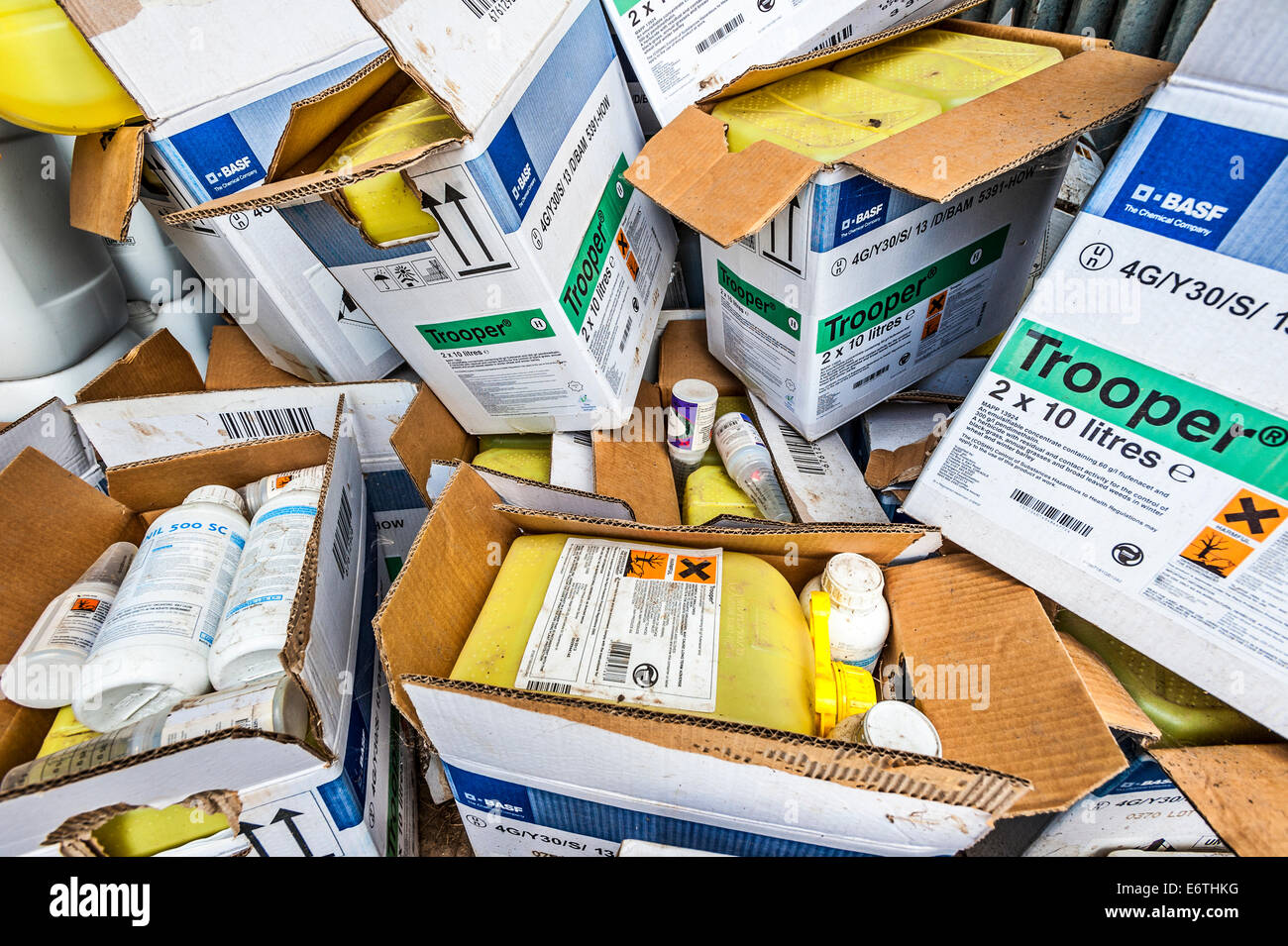 A pile of old boxes and canisters that contained weedkillers and ...
