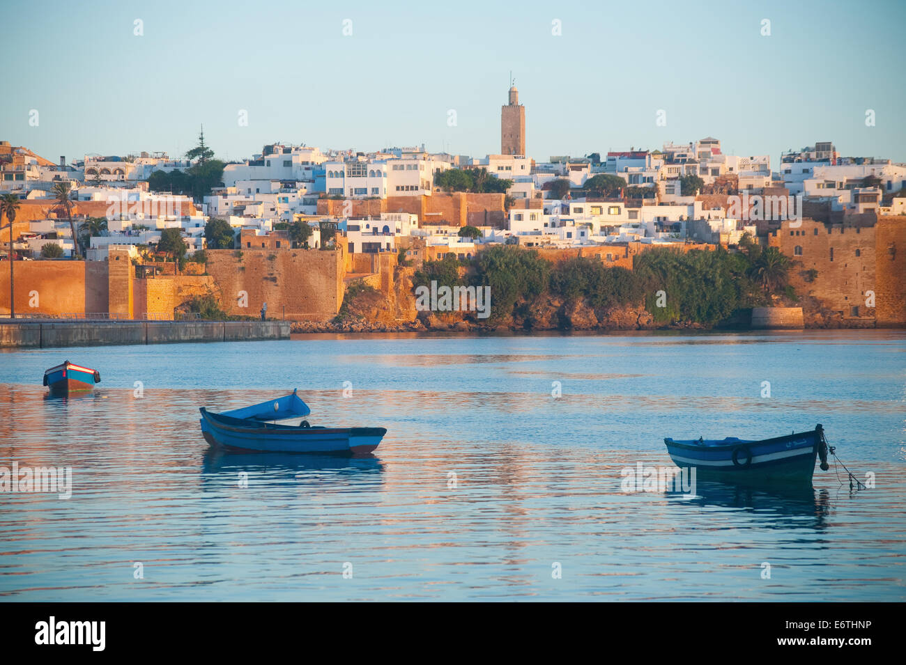 Fishermen boats on the Bou Regreg river. In the background, the Kasbah ...