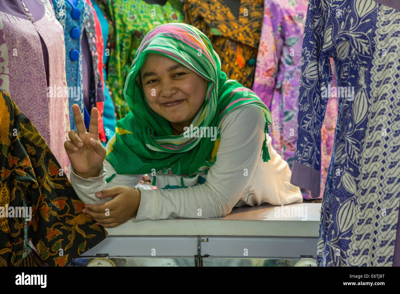 Yogyakarta, Java, Indonesia. Young Woman Clerk in a Clothing Shop ...