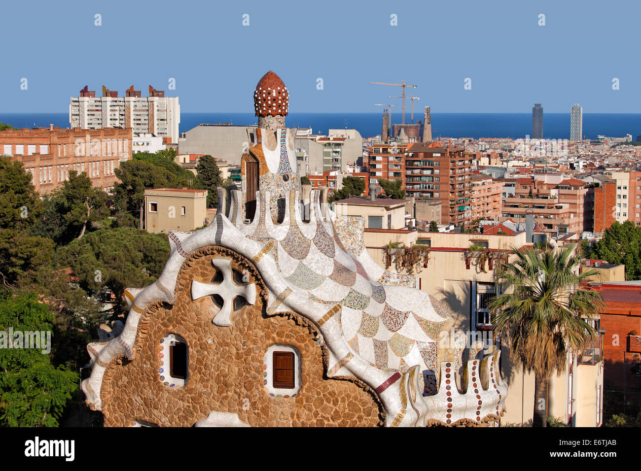 Casa del Guarda rooftop by Antoni Gaudi in Park Guell, and view over ...