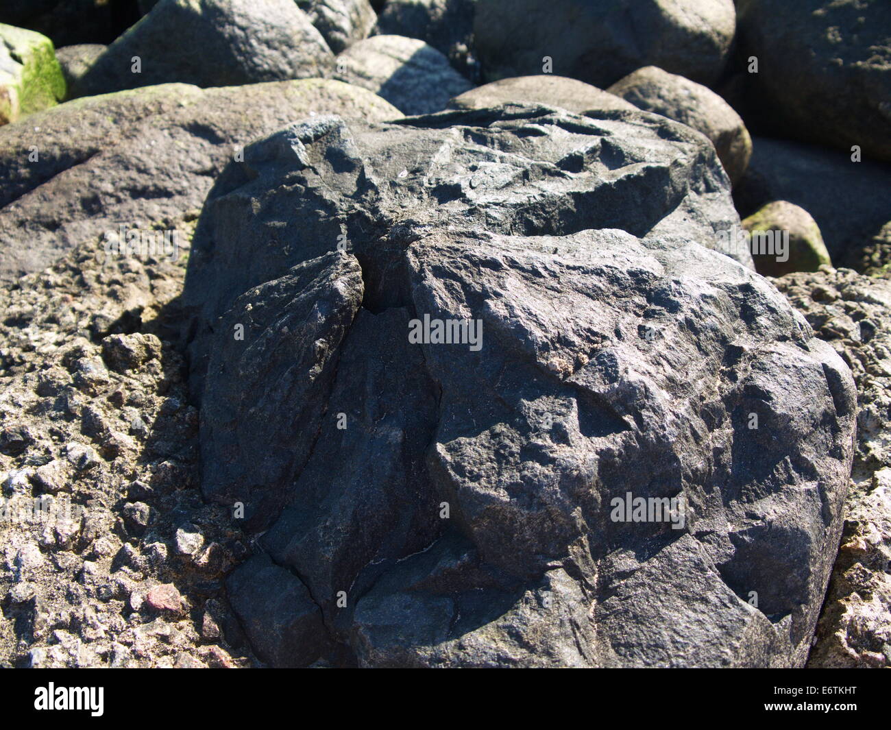 Dark grey metalic star stone in the sun Stock Photo - Alamy