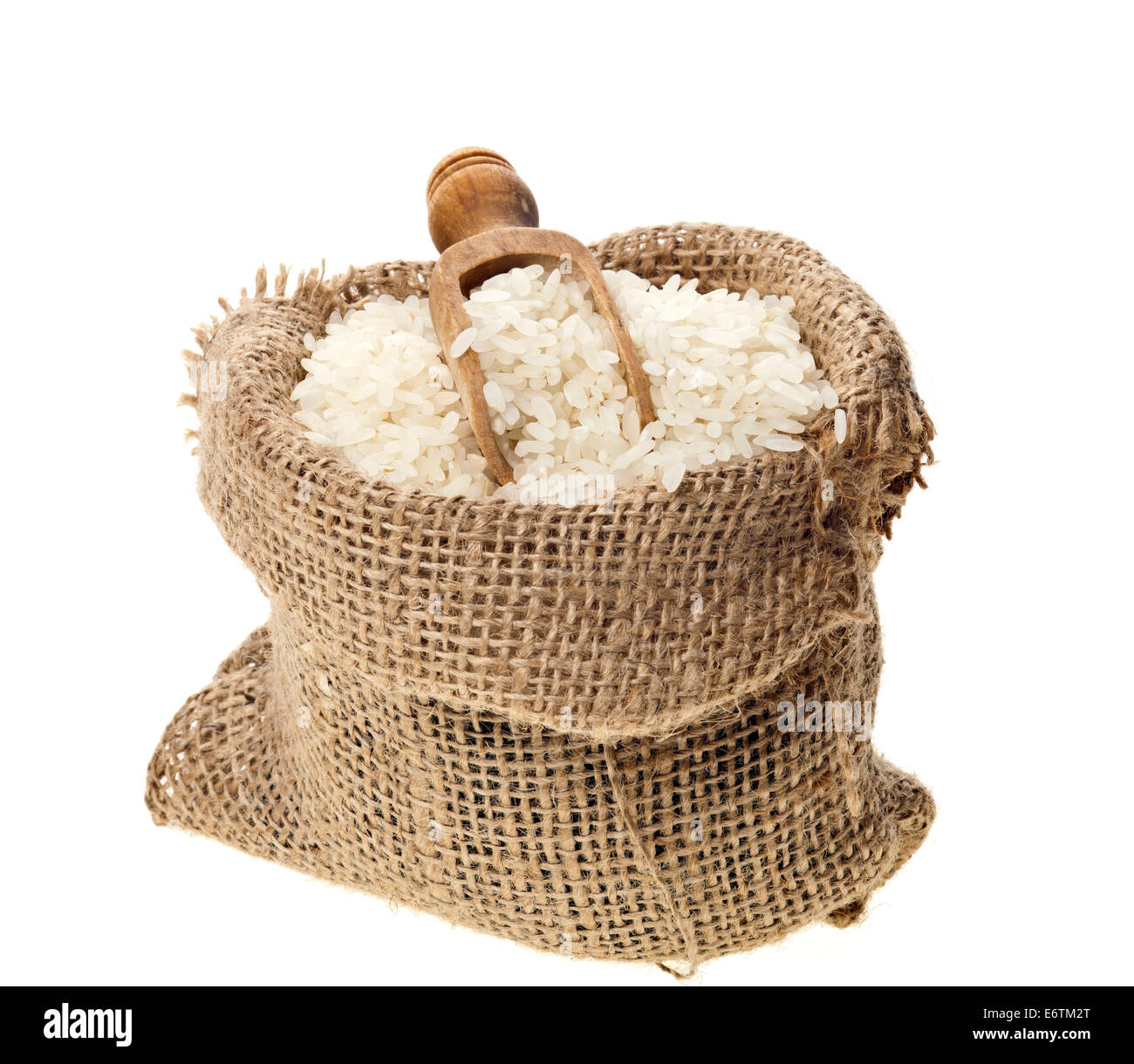 White rice in a sack and wooden scoop on a white background Stock Photo ...