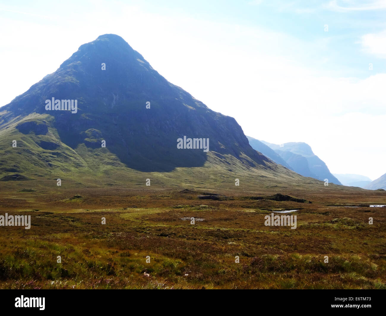 Scottish Highlands, mountain valley with blue sky Stock Photo - Alamy