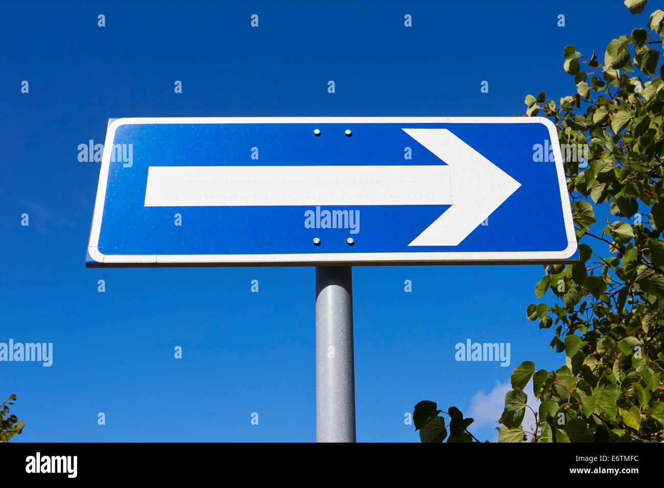 Blue traffic sign white arrow hi-res stock photography and images - Alamy