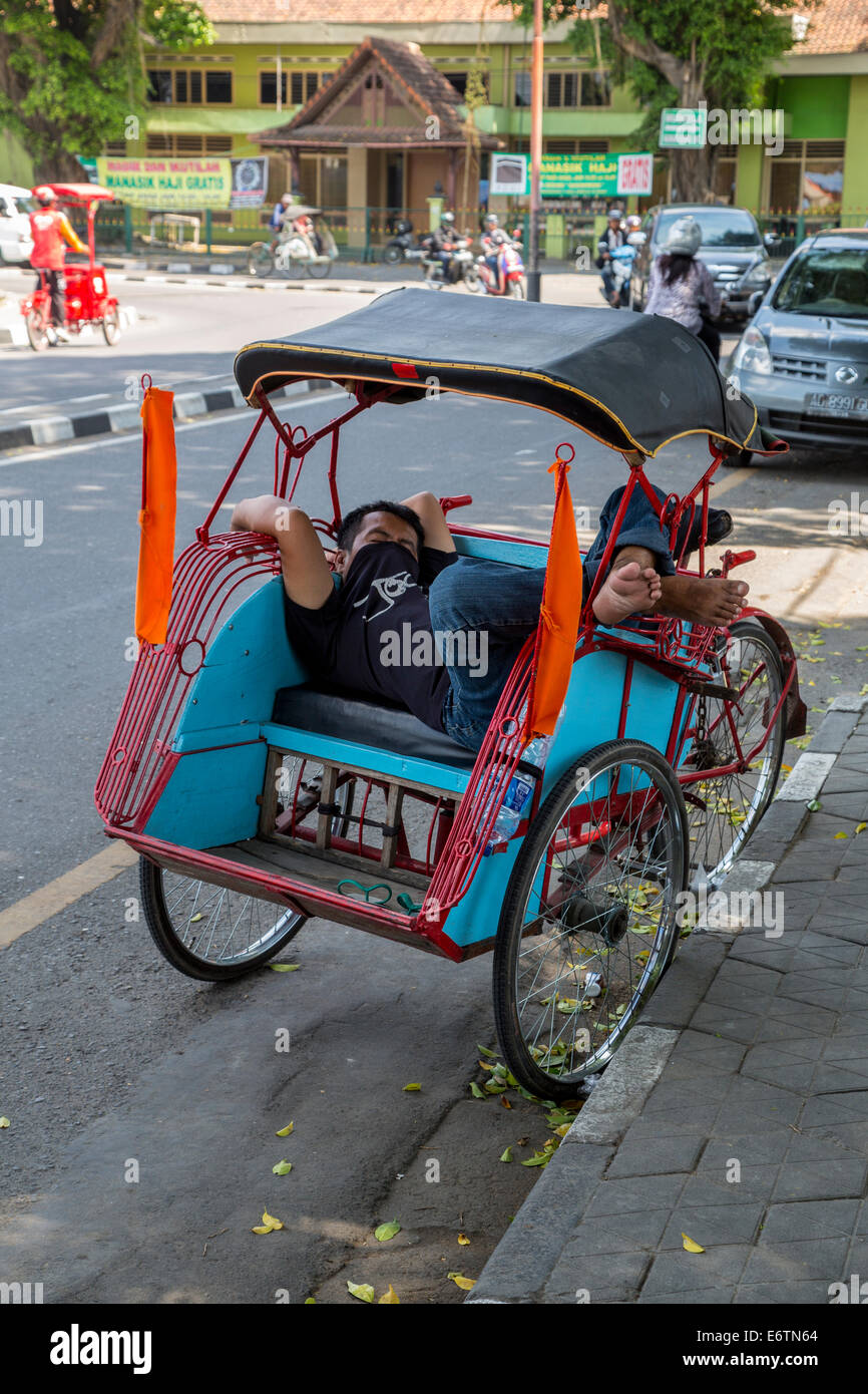 Yogyakarta, Java, Indonesia. Becak Driver Resting Stock Photo - Alamy