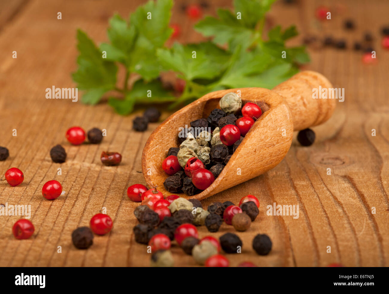 Different peppercorns on wooden hi-res stock photography and images - Alamy