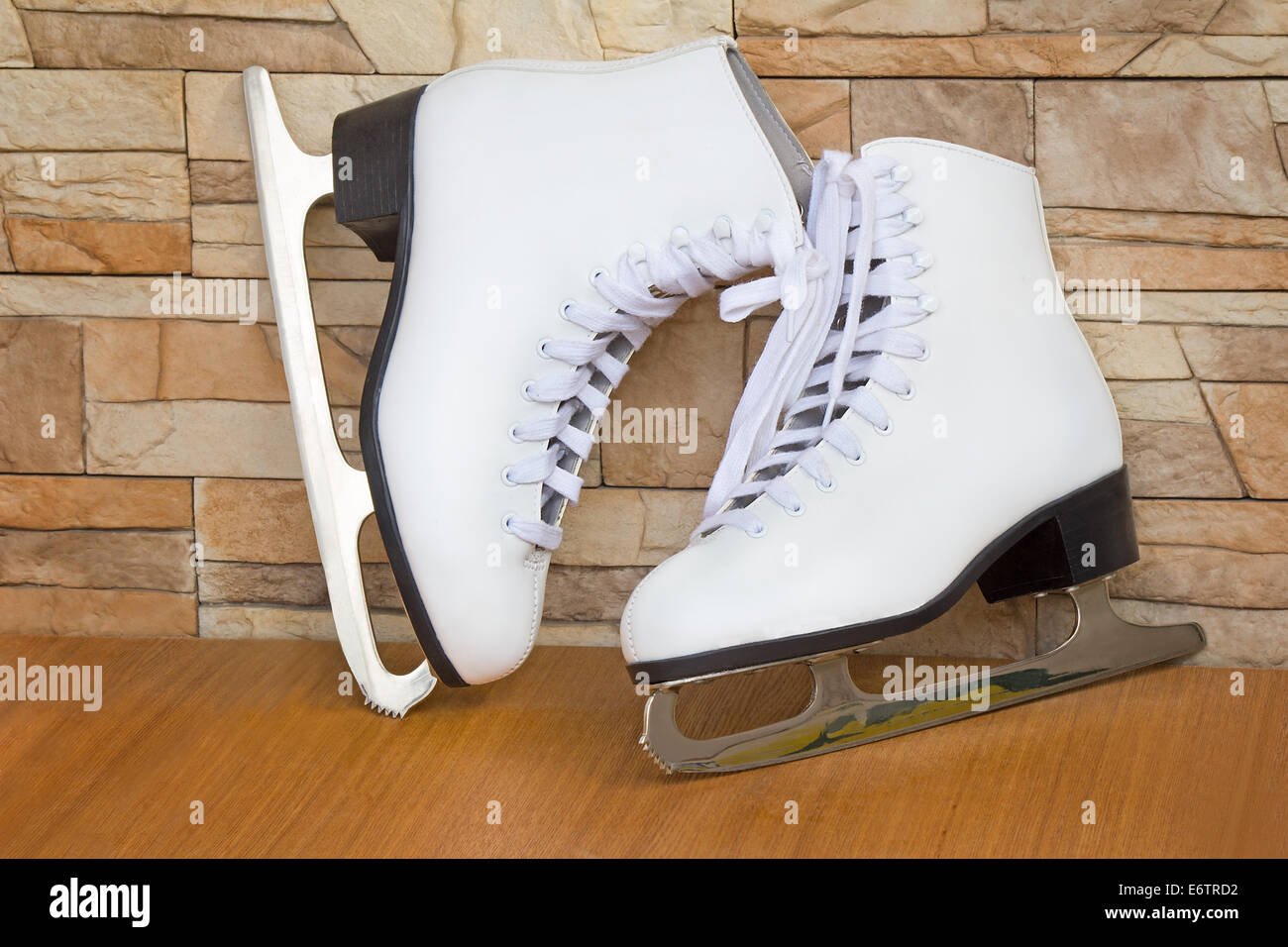 The skates and graceful boots of white color for figure skating on ice ...
