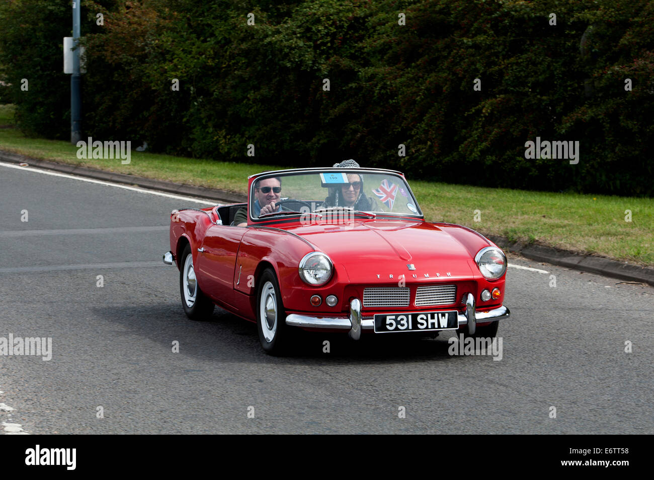 Triumph Spitfire car on the Fosse Way road, Warwickshire, UK Stock ...