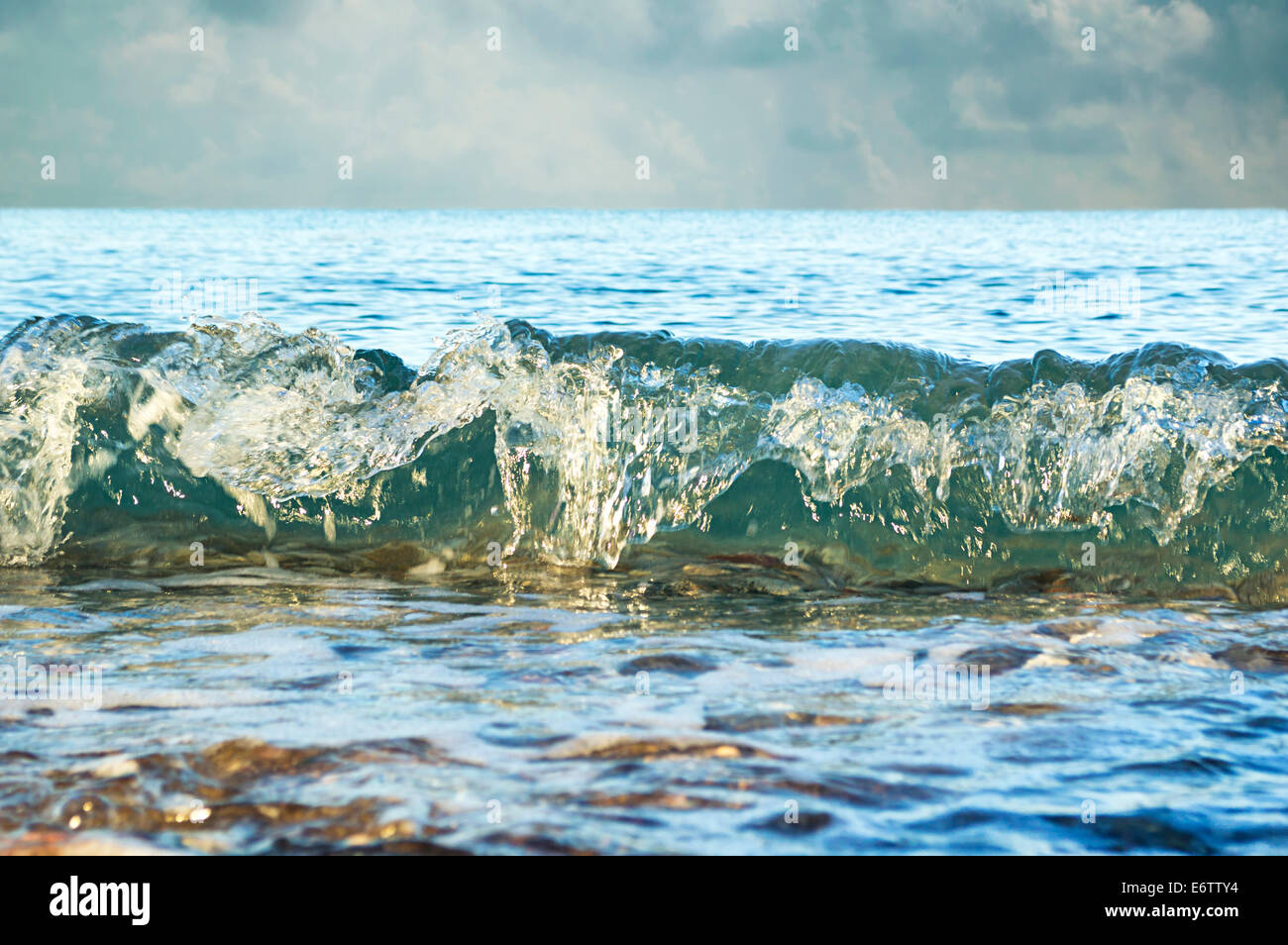 Strong waves crash over the beach Stock Photo - Alamy
