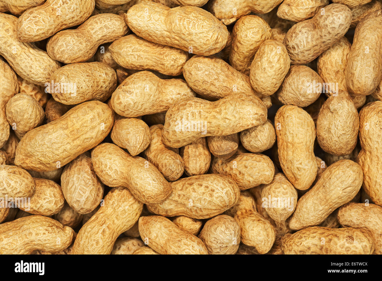 Dry roasted peanuts for use as background Stock Photo - Alamy