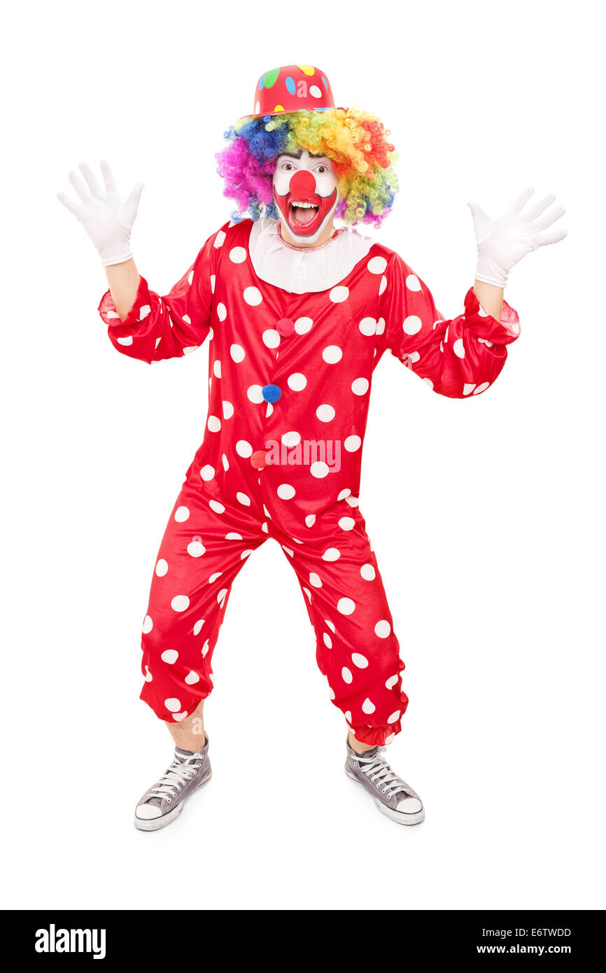 Full length portrait of a male clown gesturing with hands isolated on ...