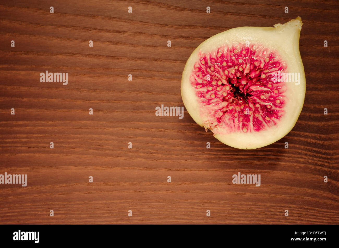 ripe fig on a wood surface Stock Photo - Alamy