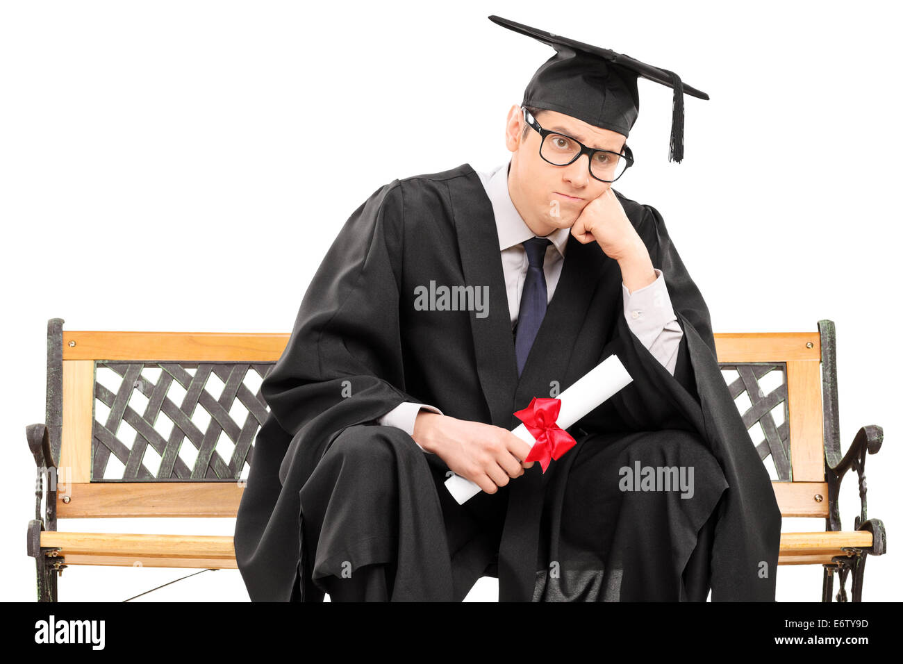 Angry college graduate holding a diploma Stock Photo - Alamy