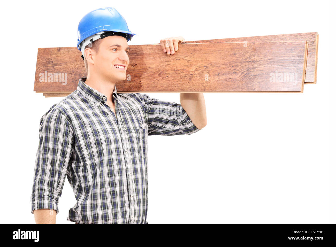 Handsome carpenter carrying a couple of planks isolated on white ...