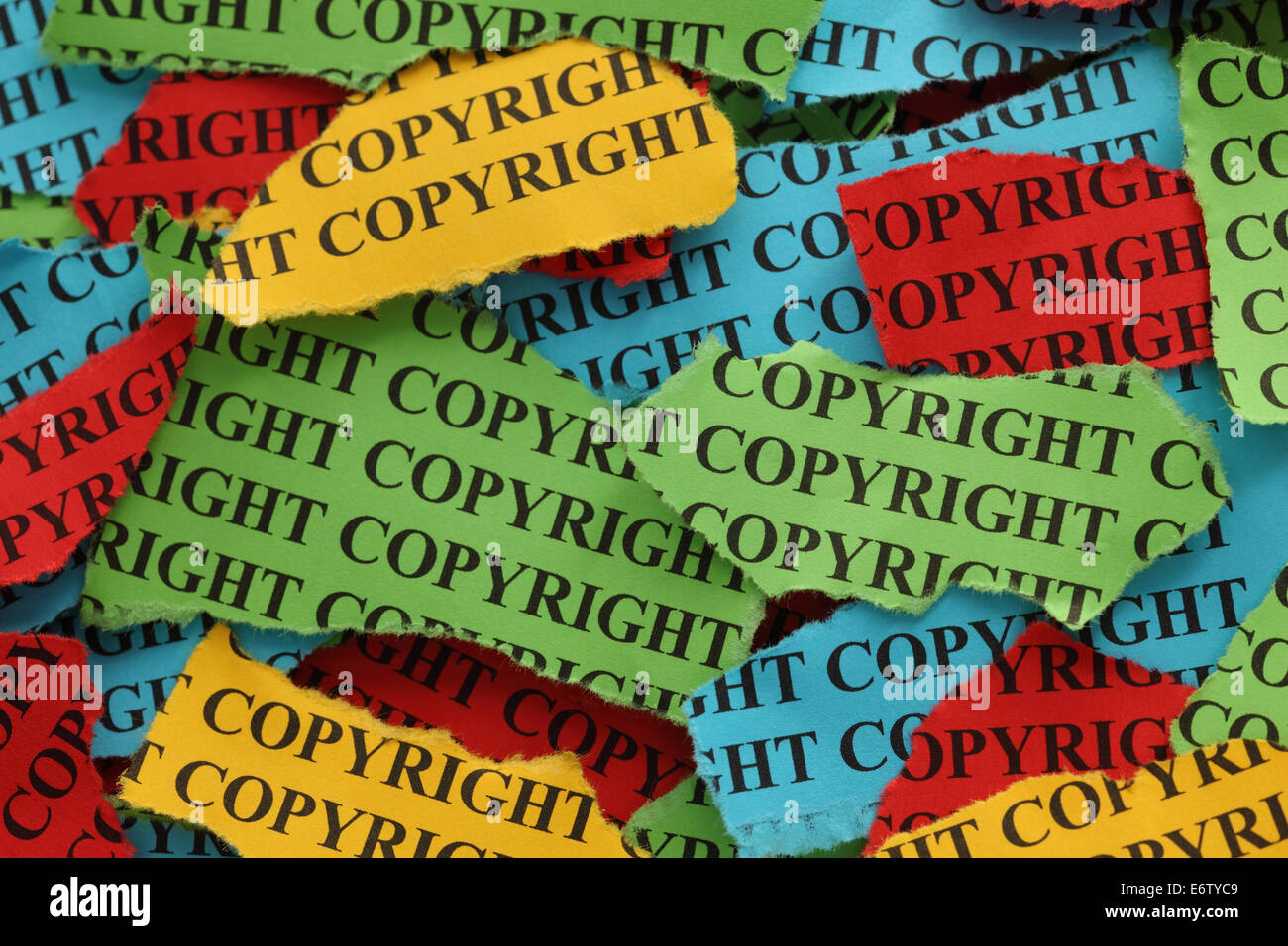 Torn pieces of colored paper with the word "Copyright". Copyright ...