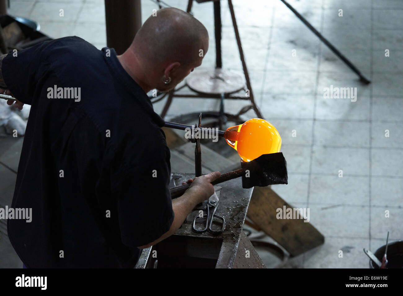 Glassmakers, Glassblowers forming molten glass, glass factory, Ajeto ...