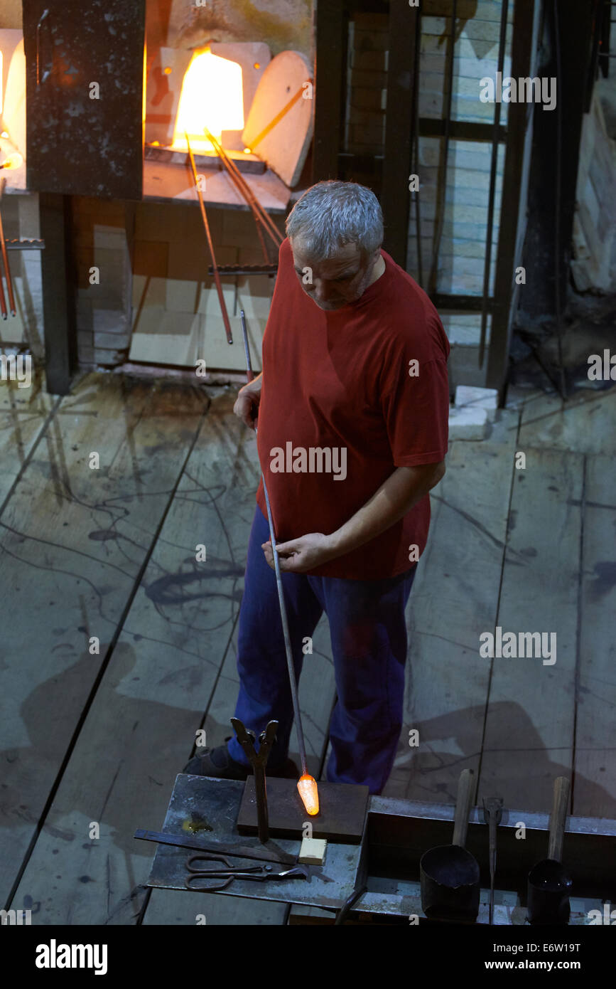 Glassmakers, Glassblowers forming molten glass, glass factory, Ajeto ...