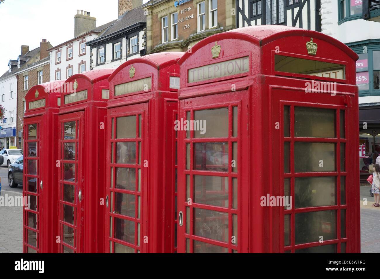 Four red telephone boxes Stock Photo - Alamy
