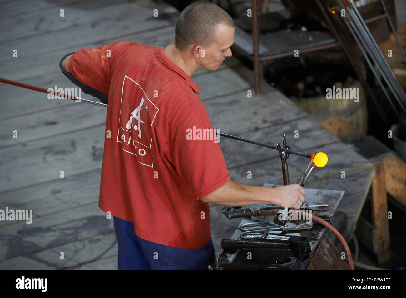 Glassmakers, Glassblowers forming molten glass, glass factory, Ajeto ...