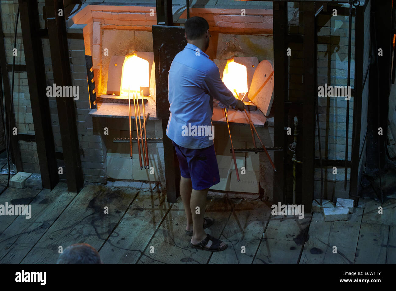 Glassmakers, Glassblowers forming molten glass, glass factory, Ajeto ...