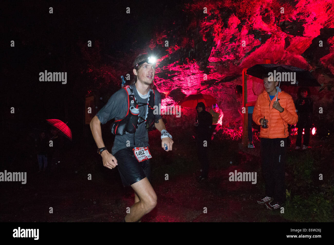 Chamonix, France. 29th Aug, 2014. A runner moves through the Notre Dame ...